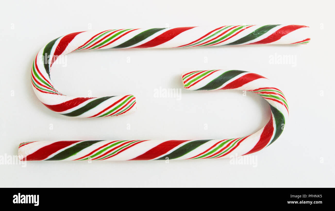 Two candy canes, red, green and white Stock Photo - Alamy