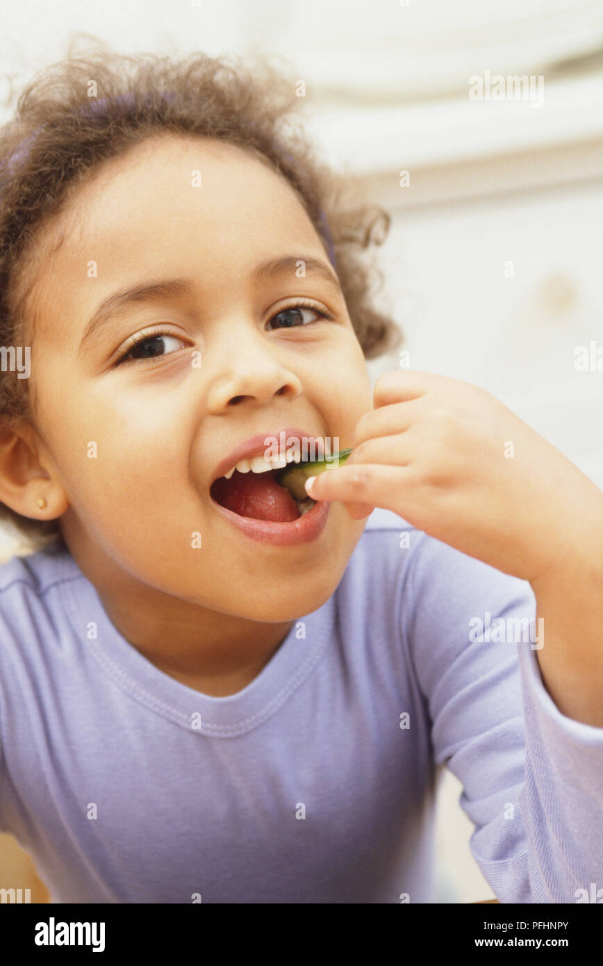 Close up girl enjoying eating hi-res stock photography and images - Alamy