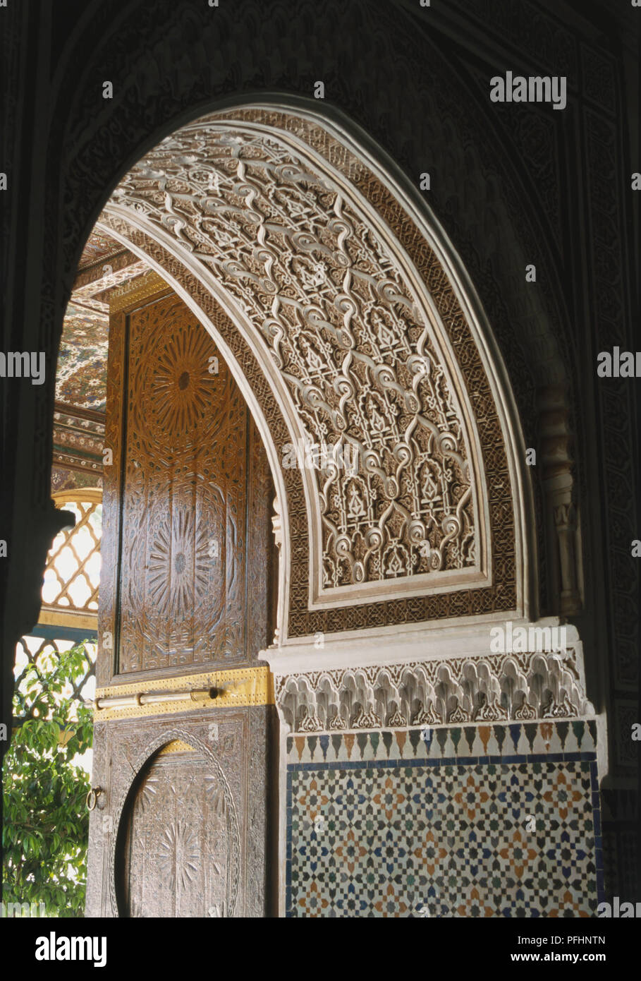 Morocco, Marrakech, Palais Bahia, intricately decorated arch leading to ...