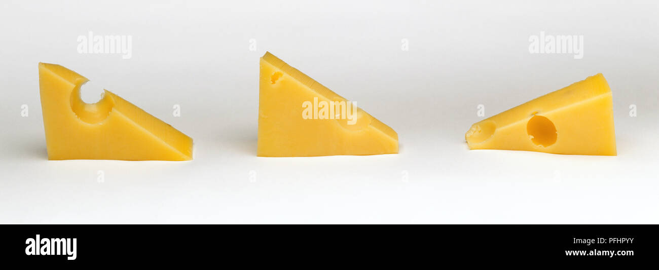 Triangular-shaped pieces of cheese Stock Photo - Alamy