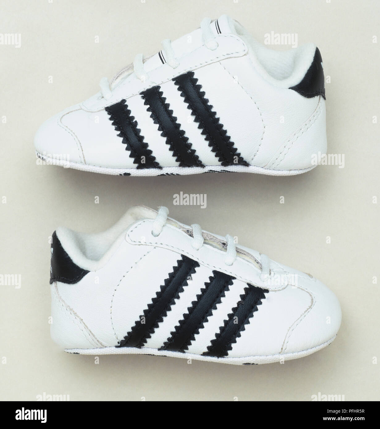 Pair of black and white trainers, side view Stock Photo - Alamy