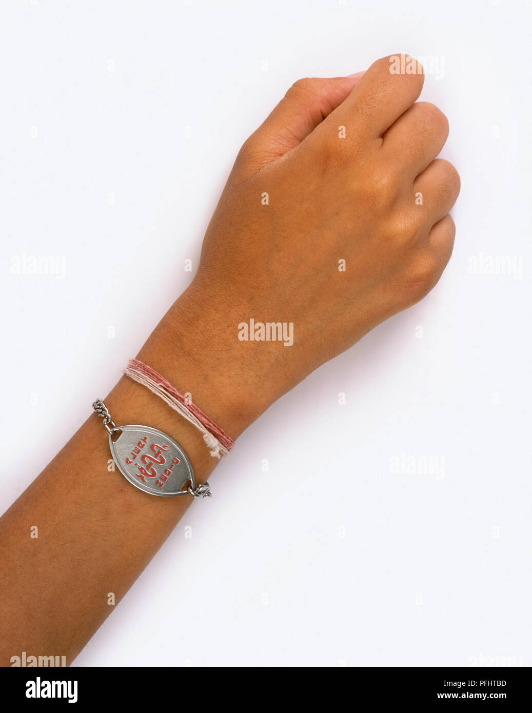 Metal medical identification tag on bracelet inscribed with snake ...