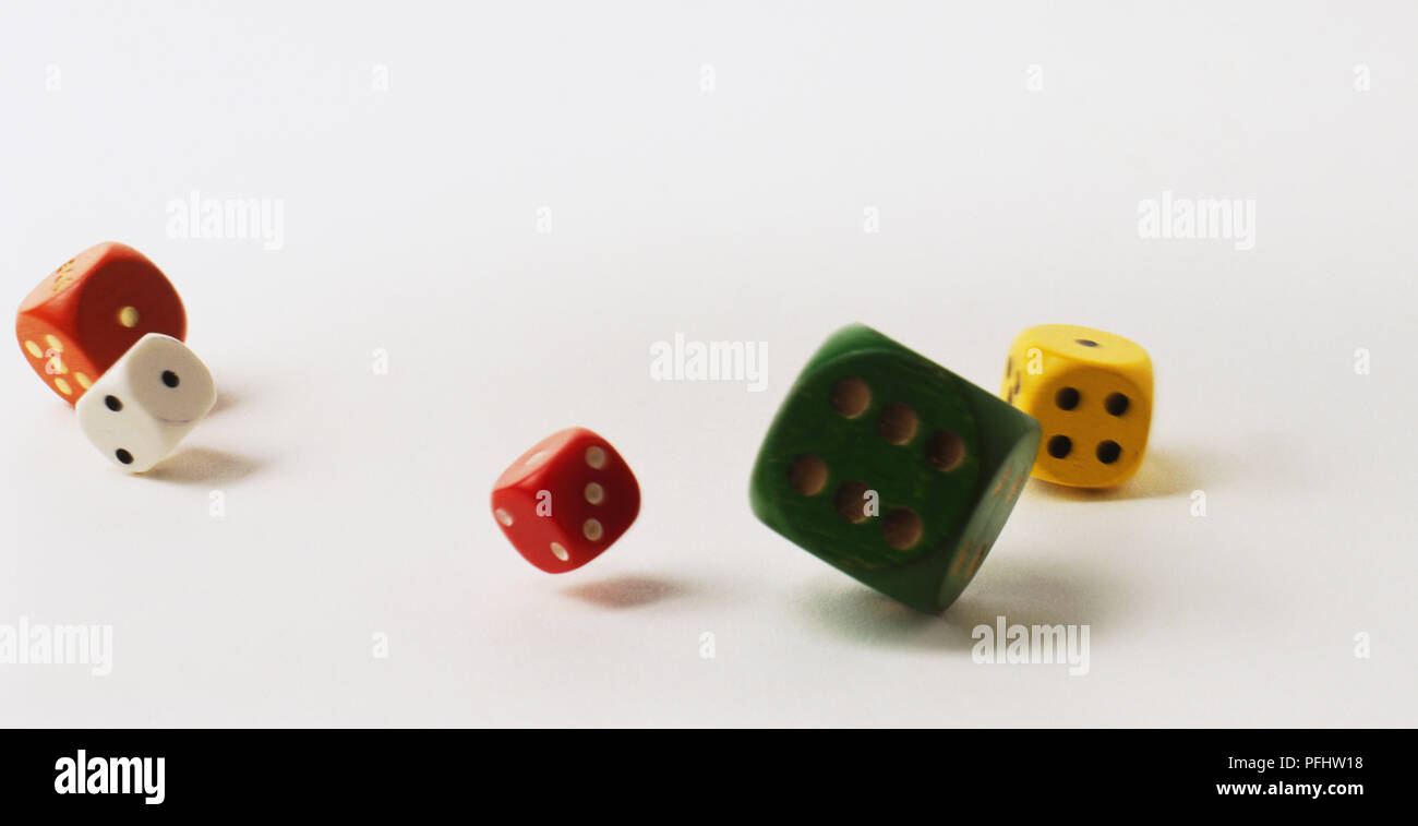 Falling dice of different colour and size, front view Stock Photo - Alamy