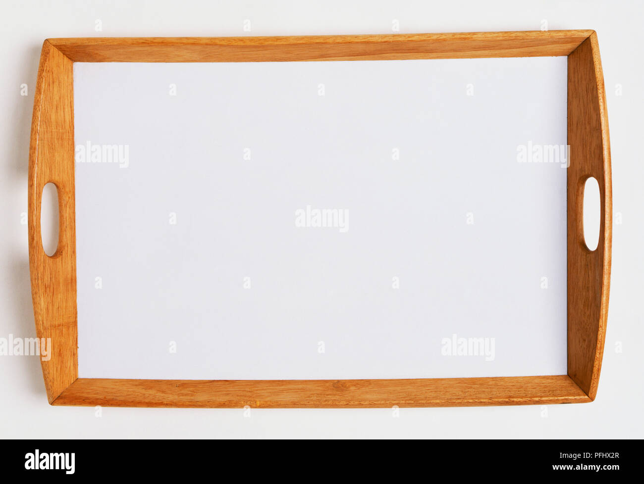 Wooden tray with handles, view from above Stock Photo - Alamy