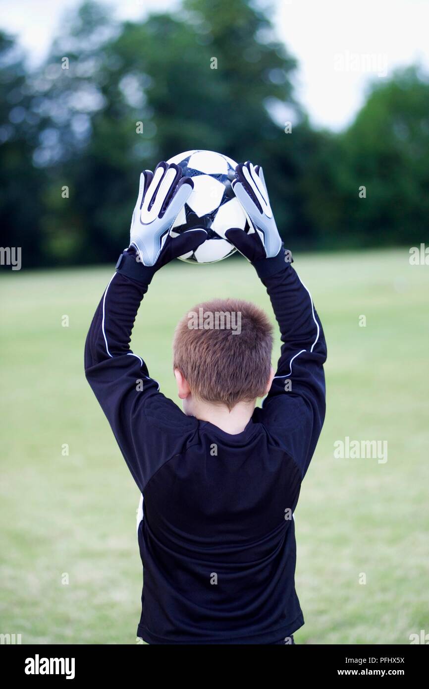 Person holding football uk hi-res stock photography and images - Alamy