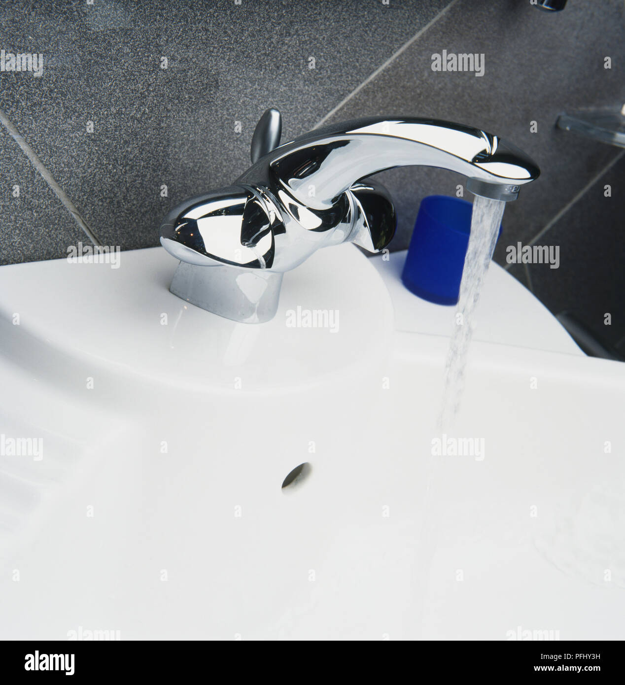 Running water tap, side view Stock Photo - Alamy