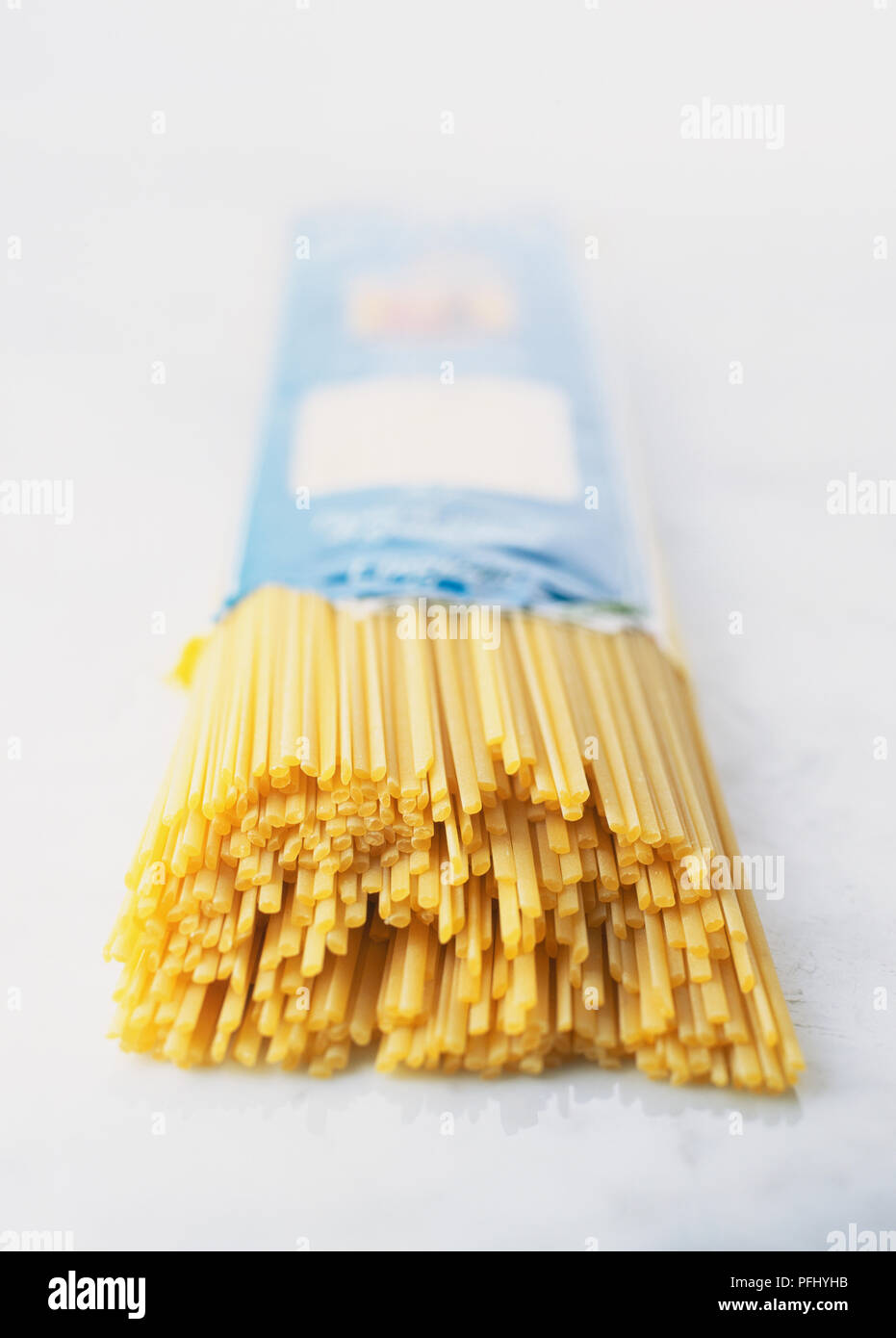 Dried linguine sticking out of an opened packet, close up Stock Photo ...