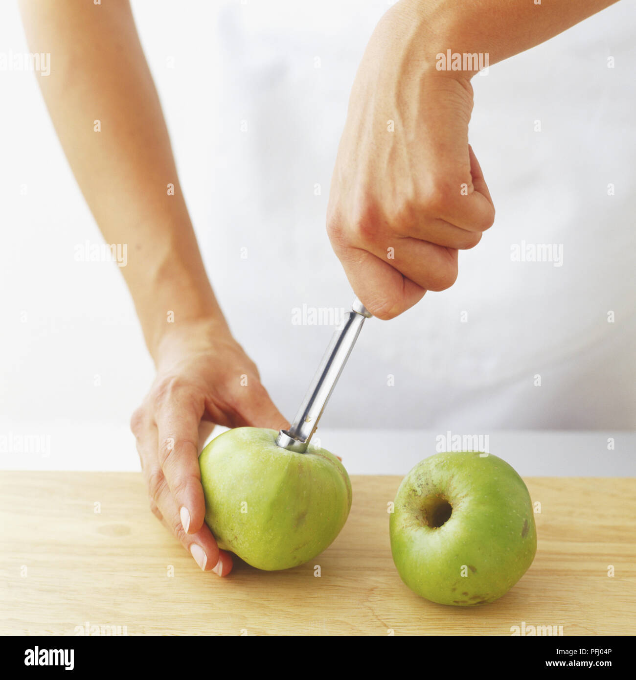 Using a coring tool to removed core from an apple Stock Photo - Alamy