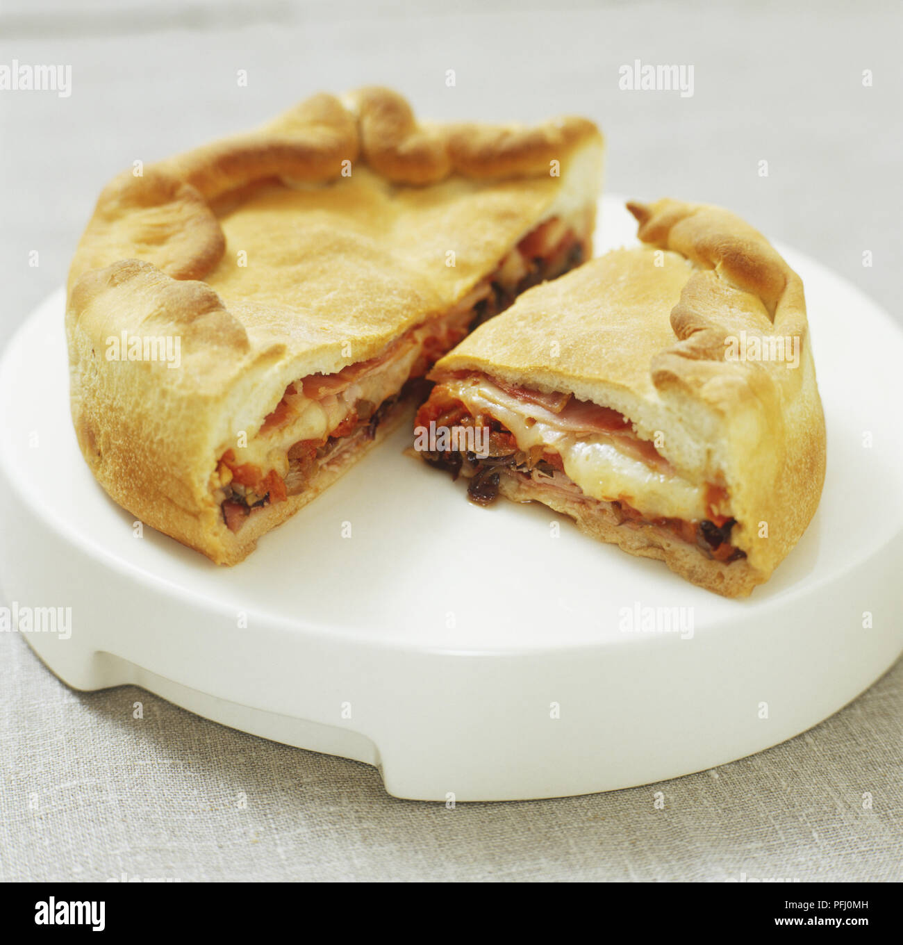 Half and quarter sections of pizza pie, side view Stock Photo - Alamy