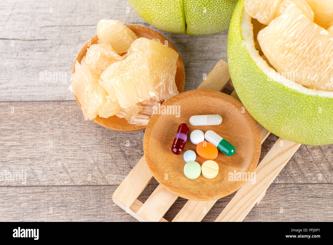 fresh and peeled pomelo(shaddock), grapefruit with slices and mooncake ...
