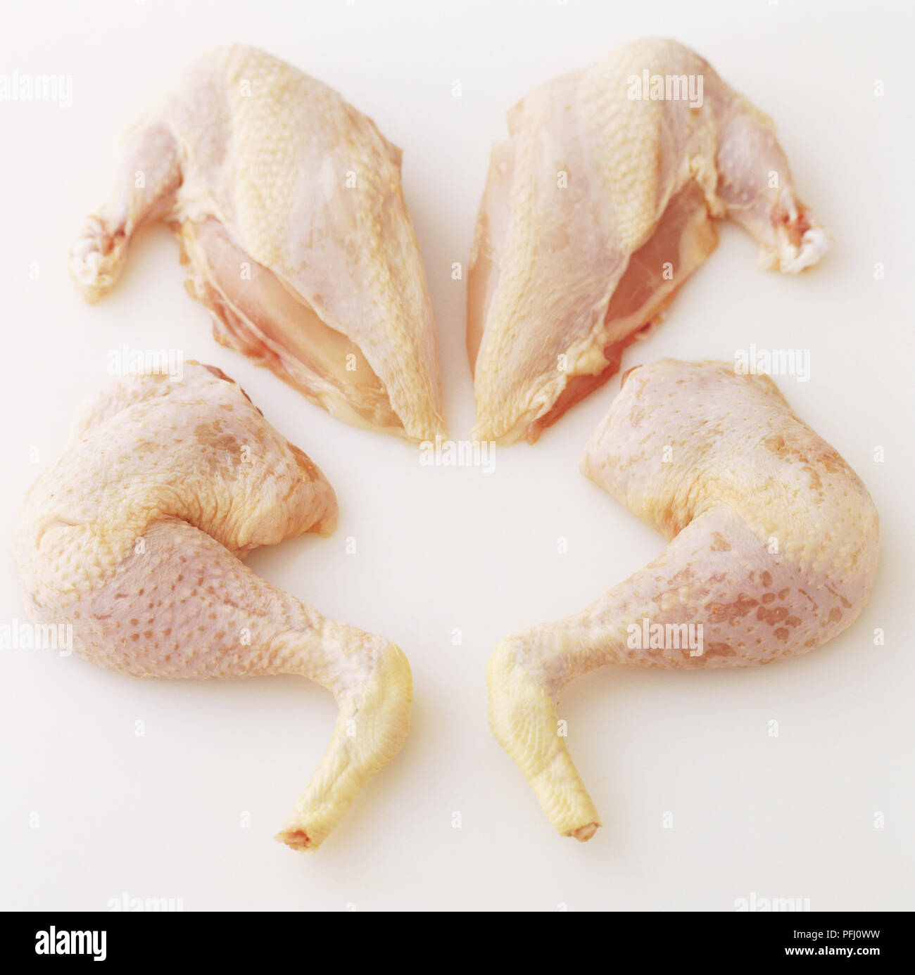 Four pieces of raw chicken Stock Photo - Alamy