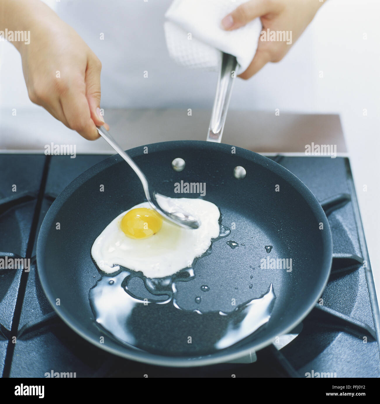 Egg poaching in pan hi-res stock photography and images - Alamy