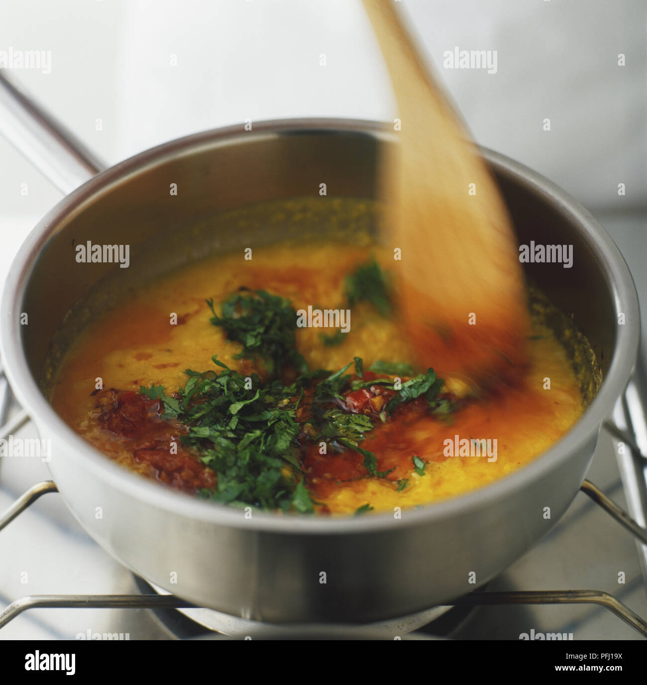 Stirring in curry ingredients hi-res stock photography and images - Alamy