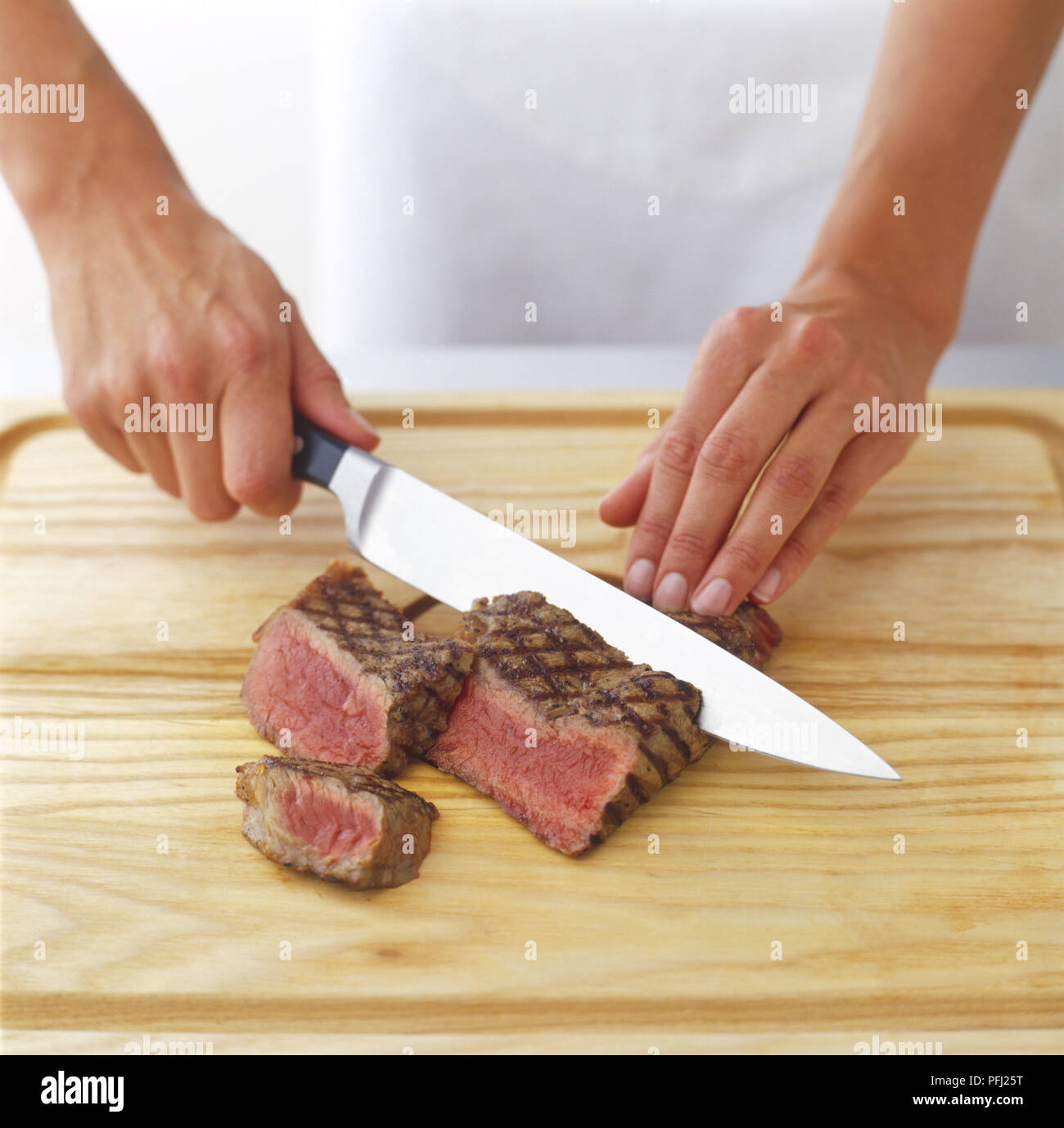 Grilled steak against white background hi-res stock photography and ...