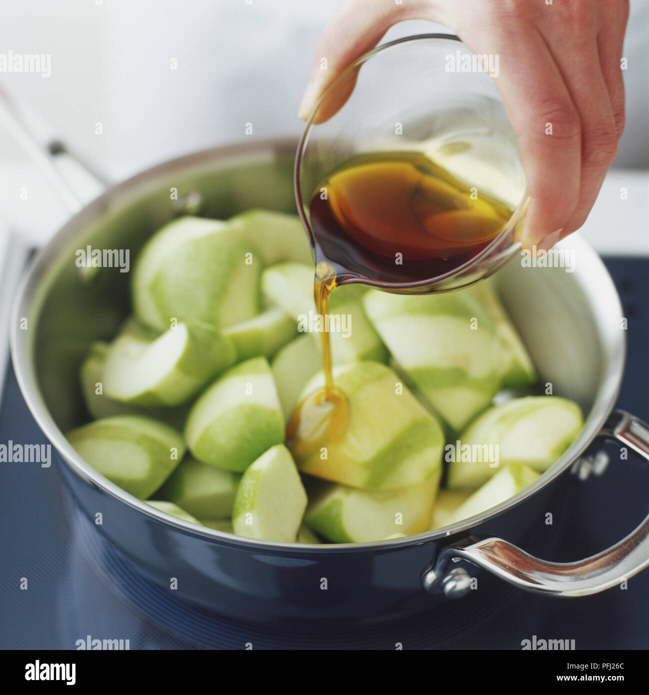 Person pouring sweet maple syrup hi-res stock photography and images ...