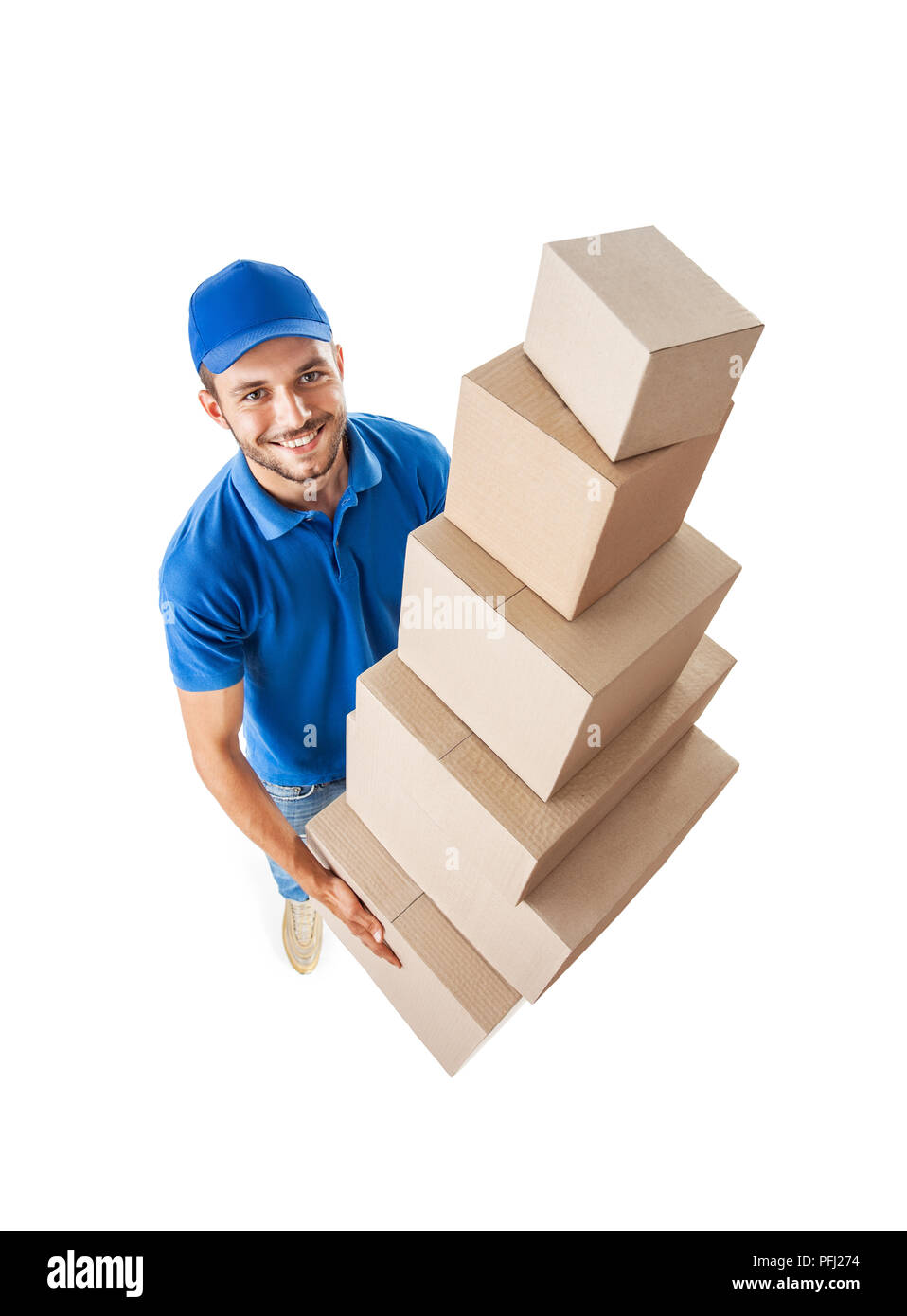 Top view of smiling express courier holding pile of cardboard boxes ...