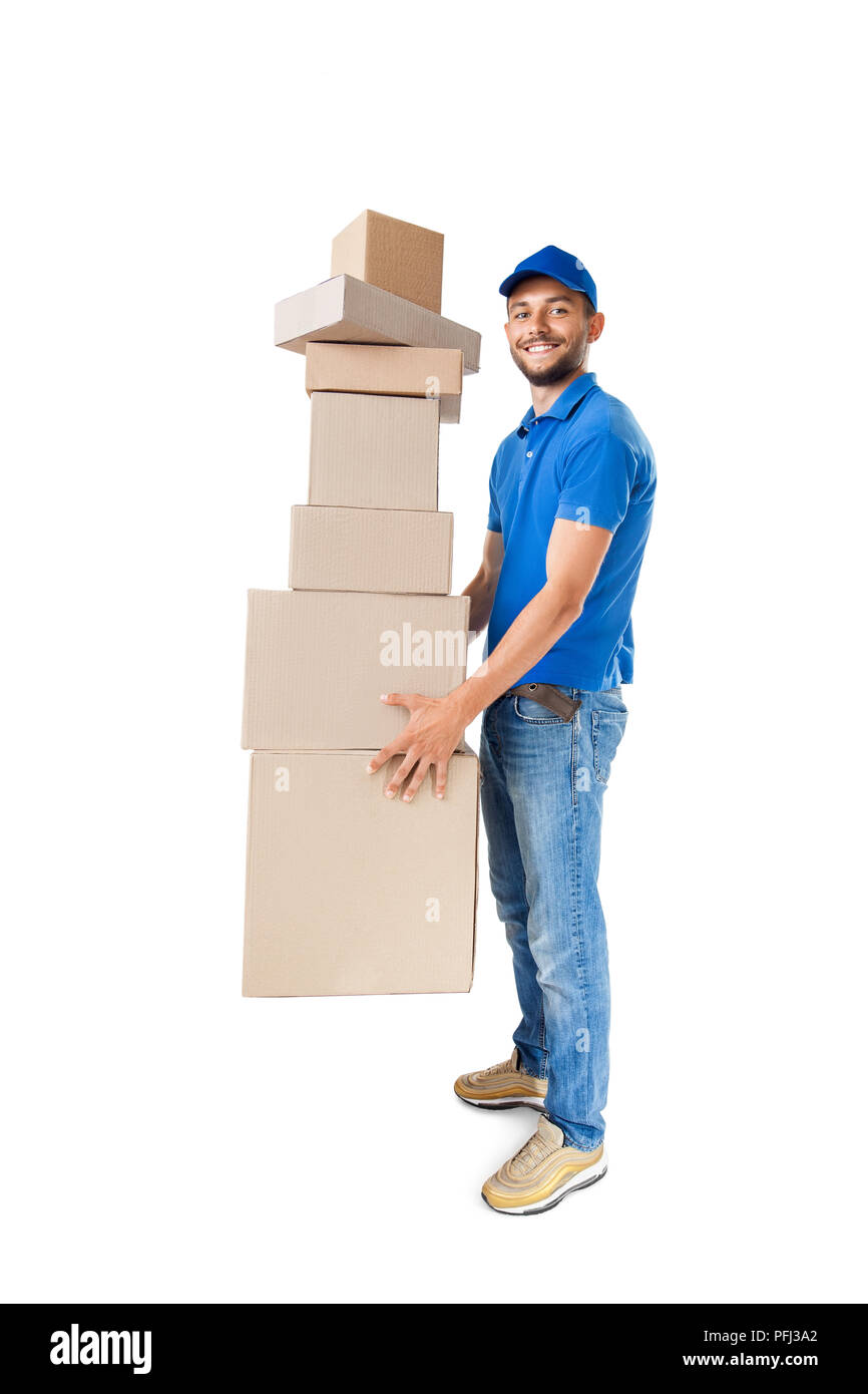 Full length profile portrait of courier carrying stack of boxes ...