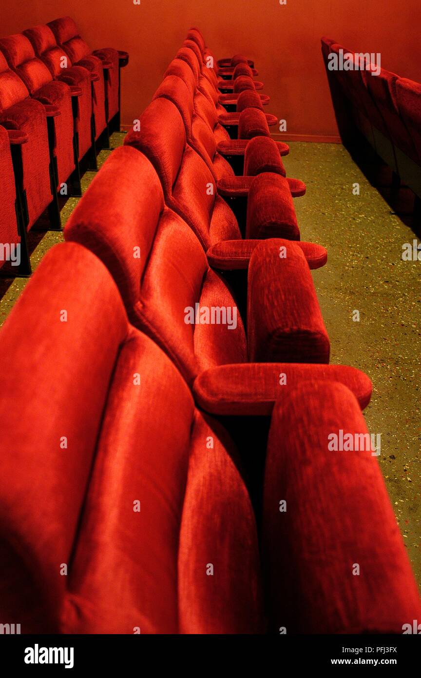 Row of red theatre seating Stock Photo - Alamy