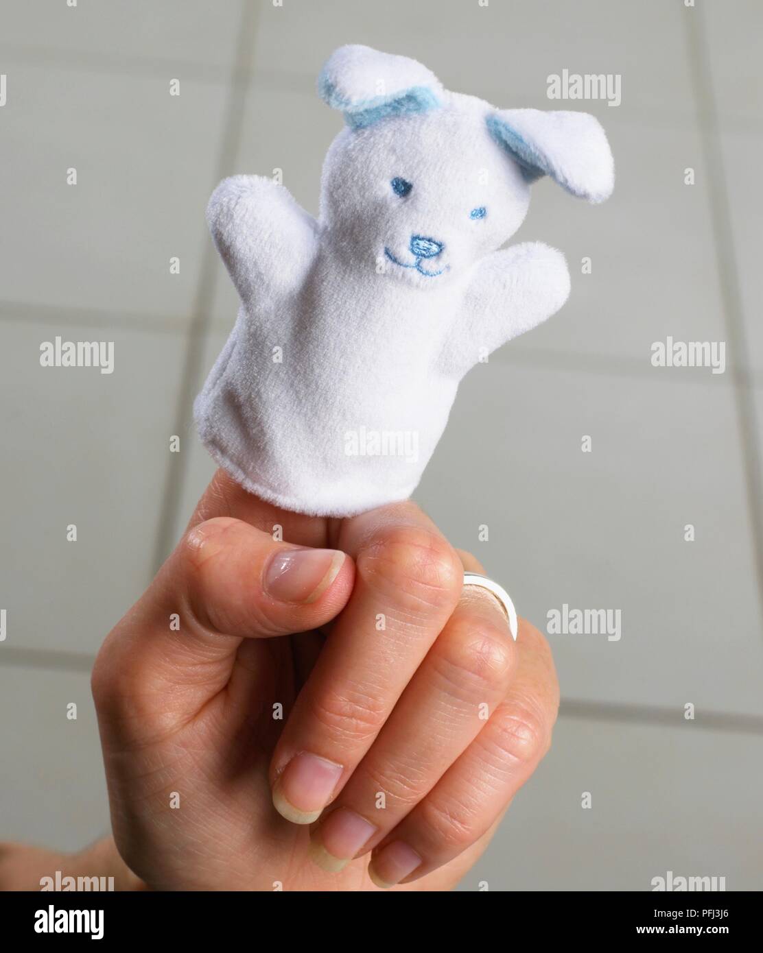 Hand with puppet on finger Stock Photo - Alamy