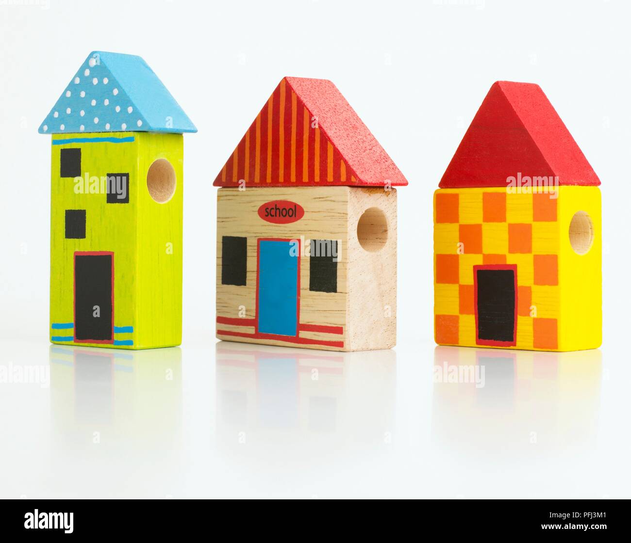 Three wooden toy houses Stock Photo - Alamy