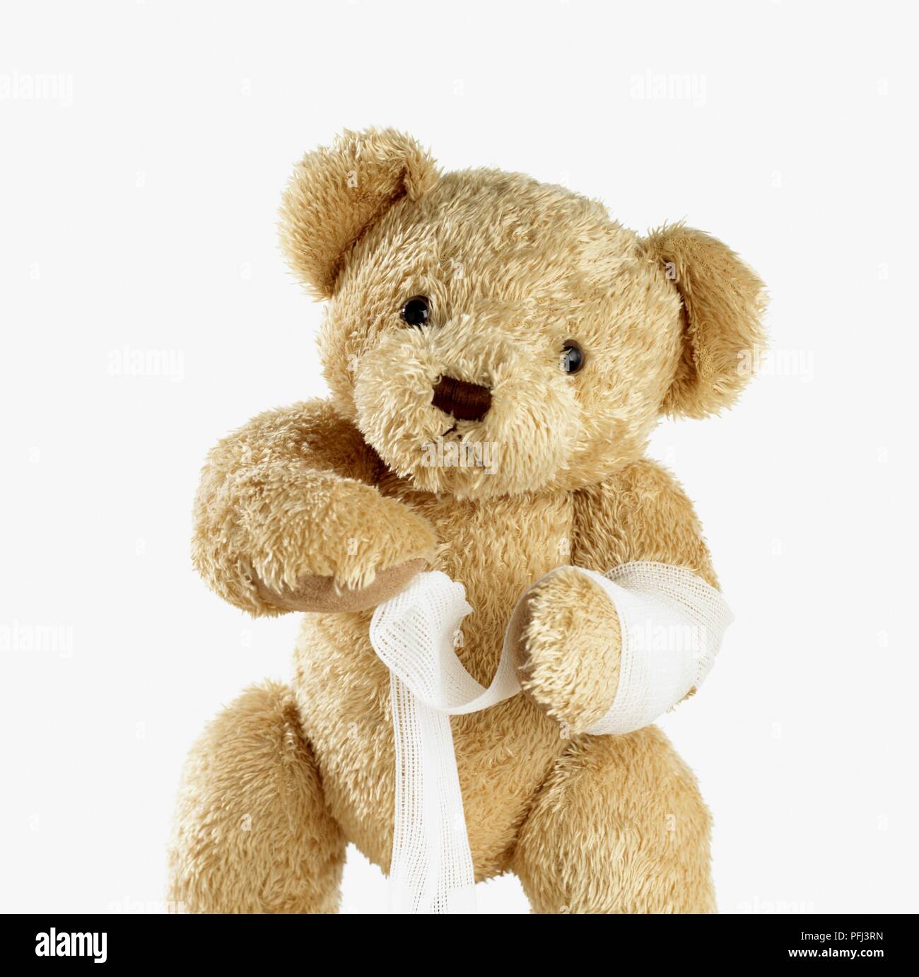 Soft toy, teddy bear wrapped in bandages Stock Photo - Alamy