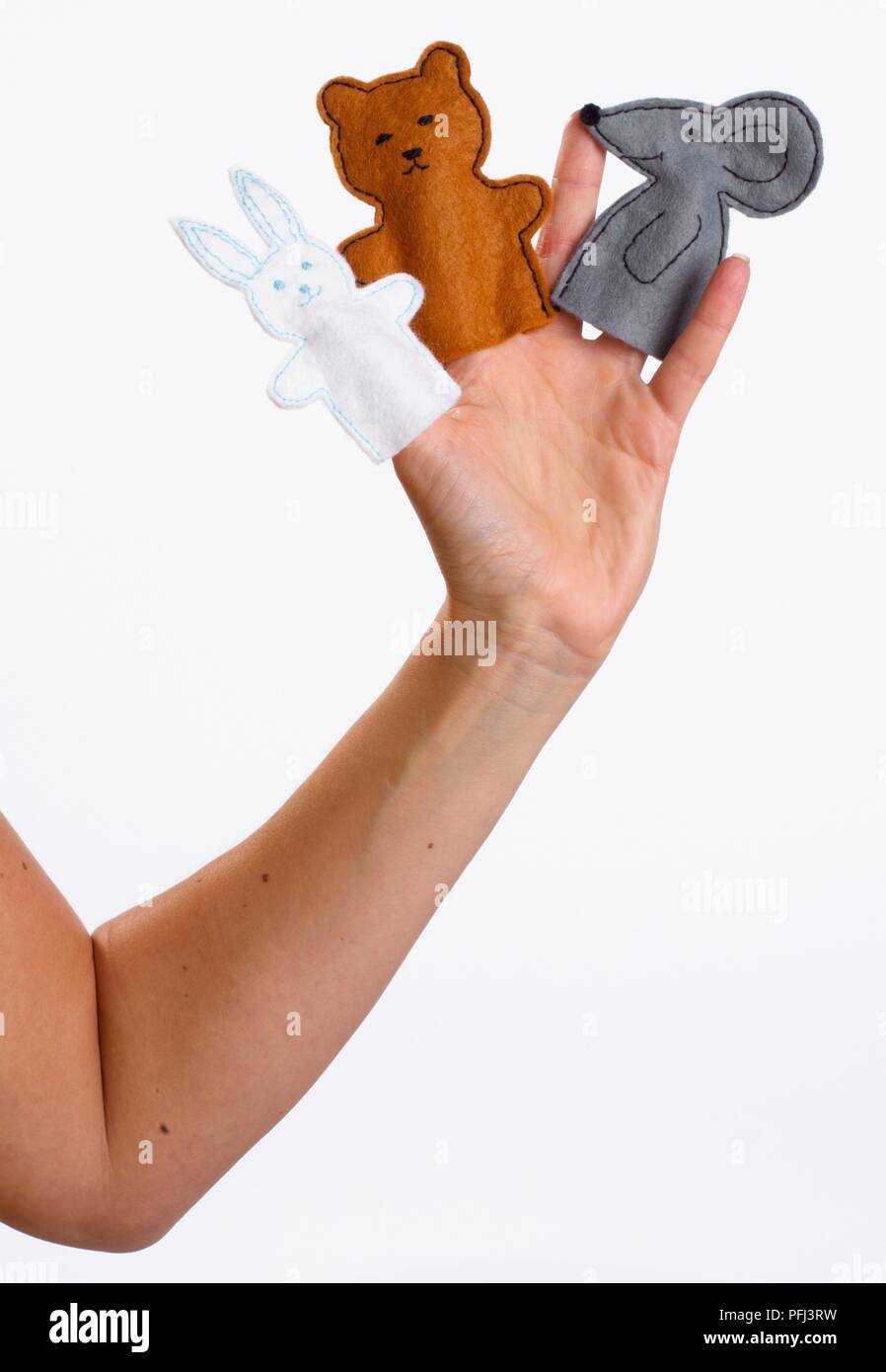 Three different finger puppets on a woman's hand Stock Photo - Alamy