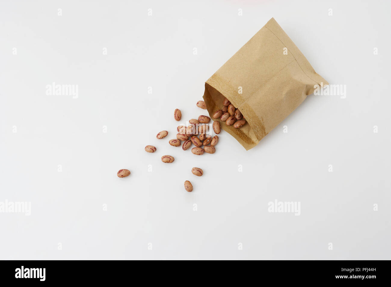 Scarlet runner bean seeds spilling out of brown paper envelope Stock ...