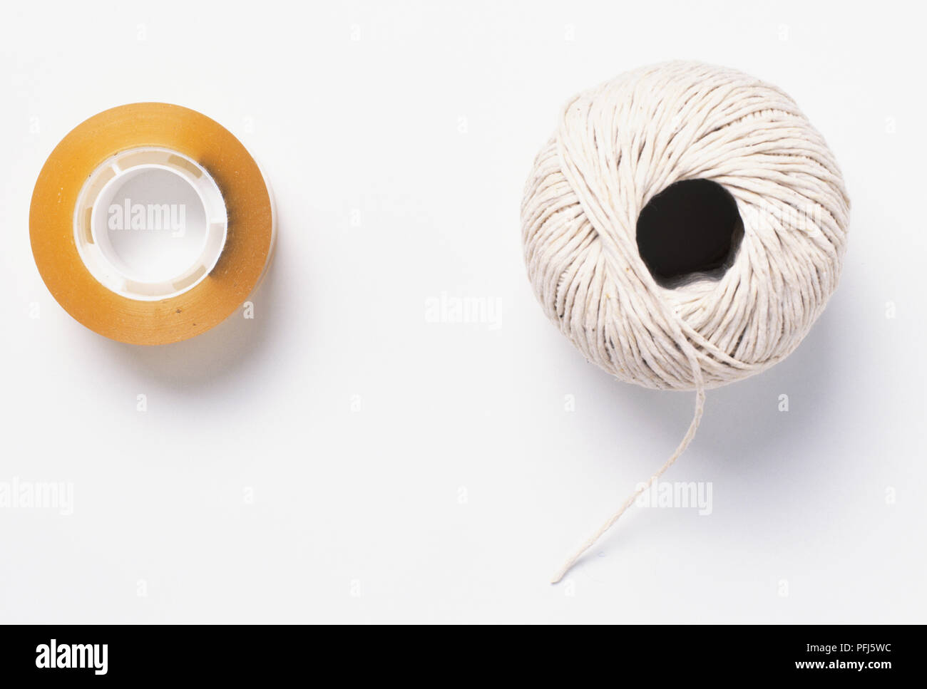 Roll of sticky tape and spool of string, view from above Stock Photo ...