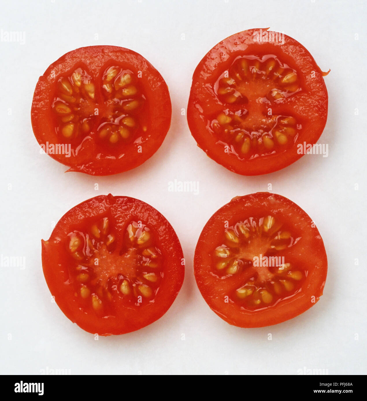 Four slices of tomato Stock Photo - Alamy