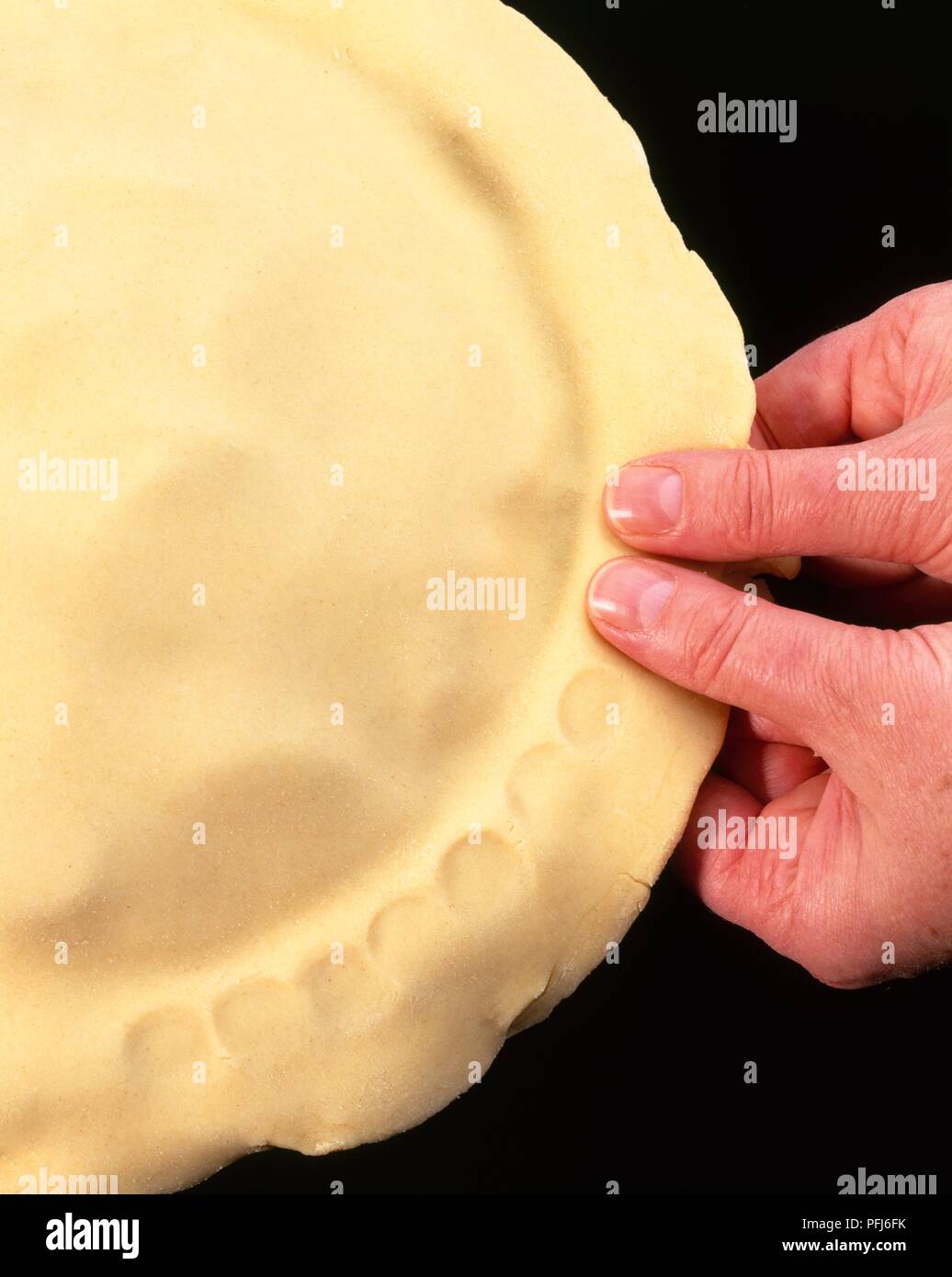 Fingers sealing the pastry lid on a dessert pie, close-up Stock Photo ...