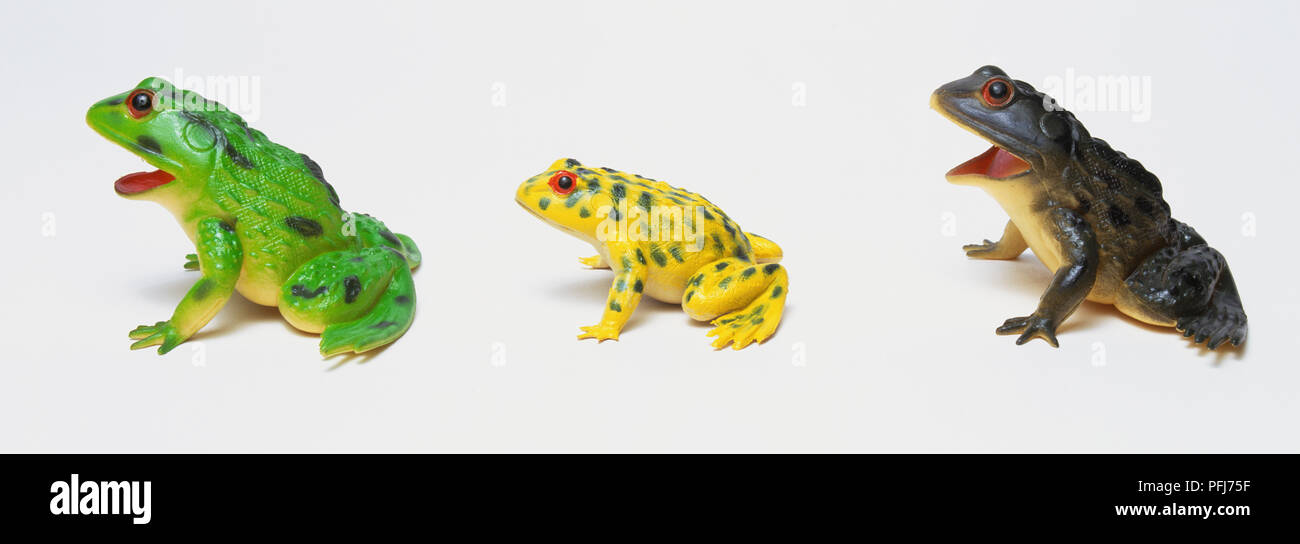 Three plastic frogs, side view Stock Photo - Alamy