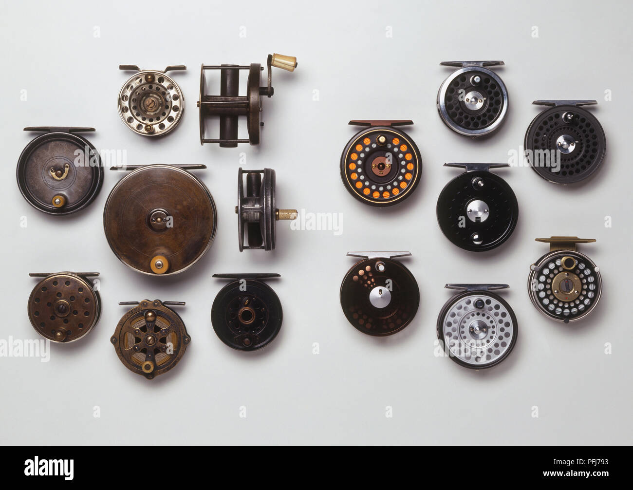Collection of antique and modern fishing reels Stock Photo - Alamy