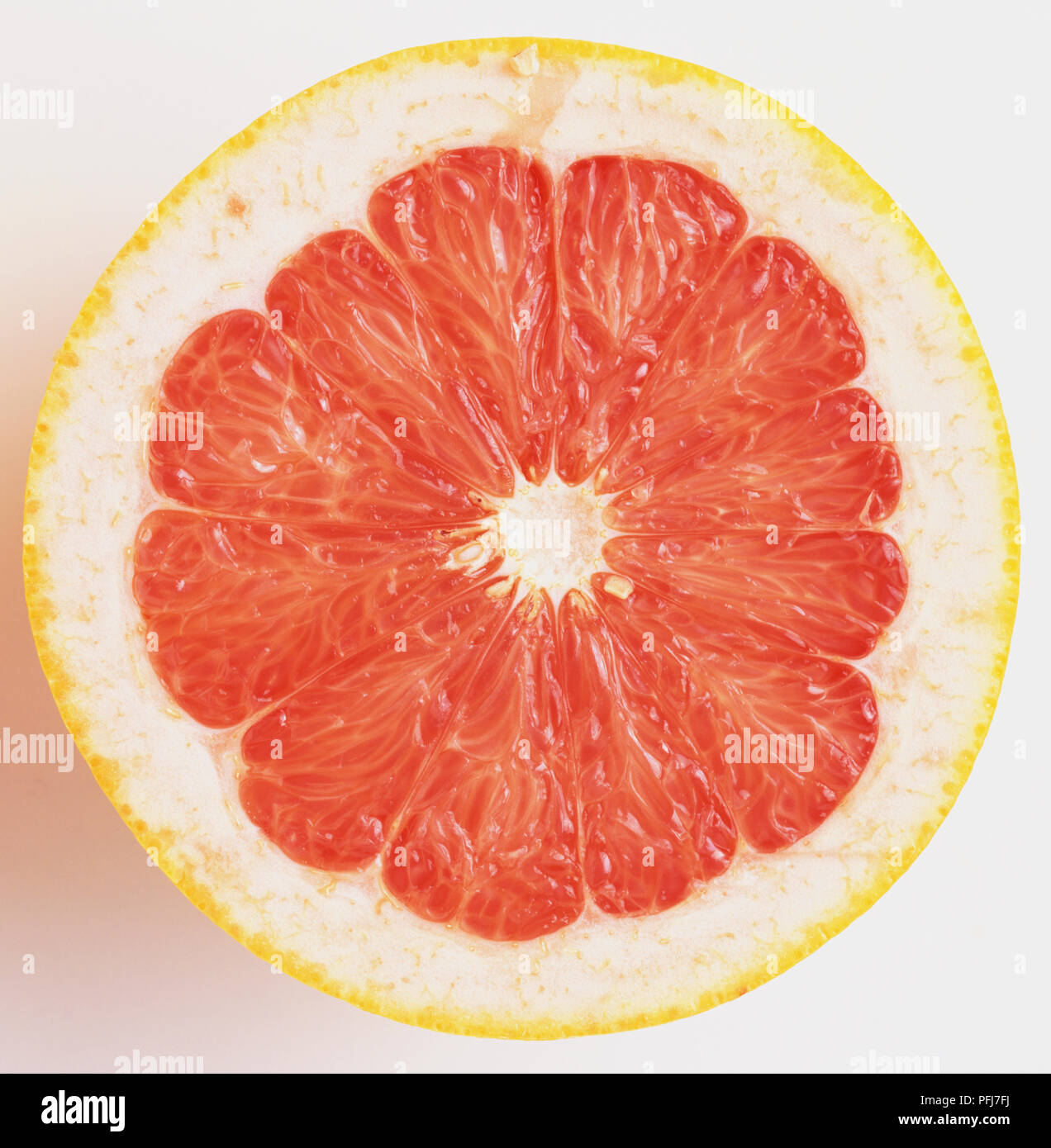 Citrus paradisi, Grapefruit, sliced, showing red flesh Stock Photo - Alamy