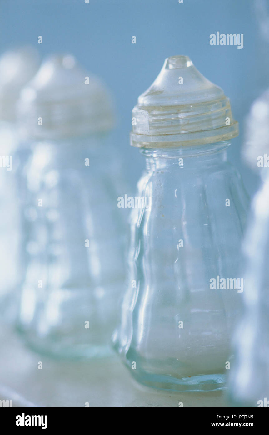 Two small glass flasks, structured lengthways in regular indentations ...