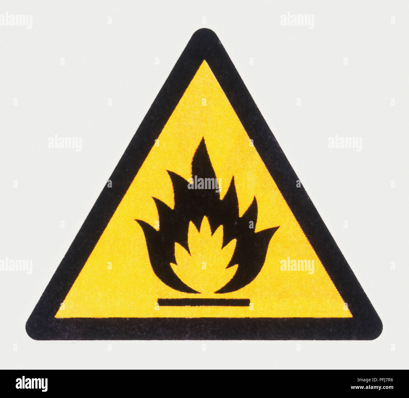 The symbol of fire on a yellow triangular sign Stock Photo - Alamy