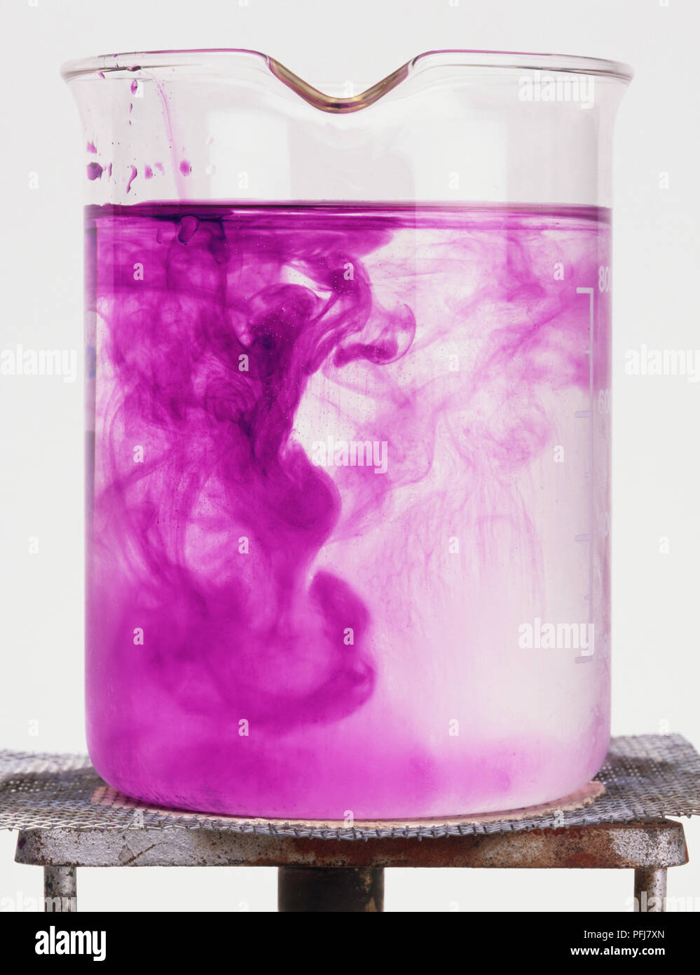 Diffuse, veil-like purple liquid in glass jar, standing on bunsen ...