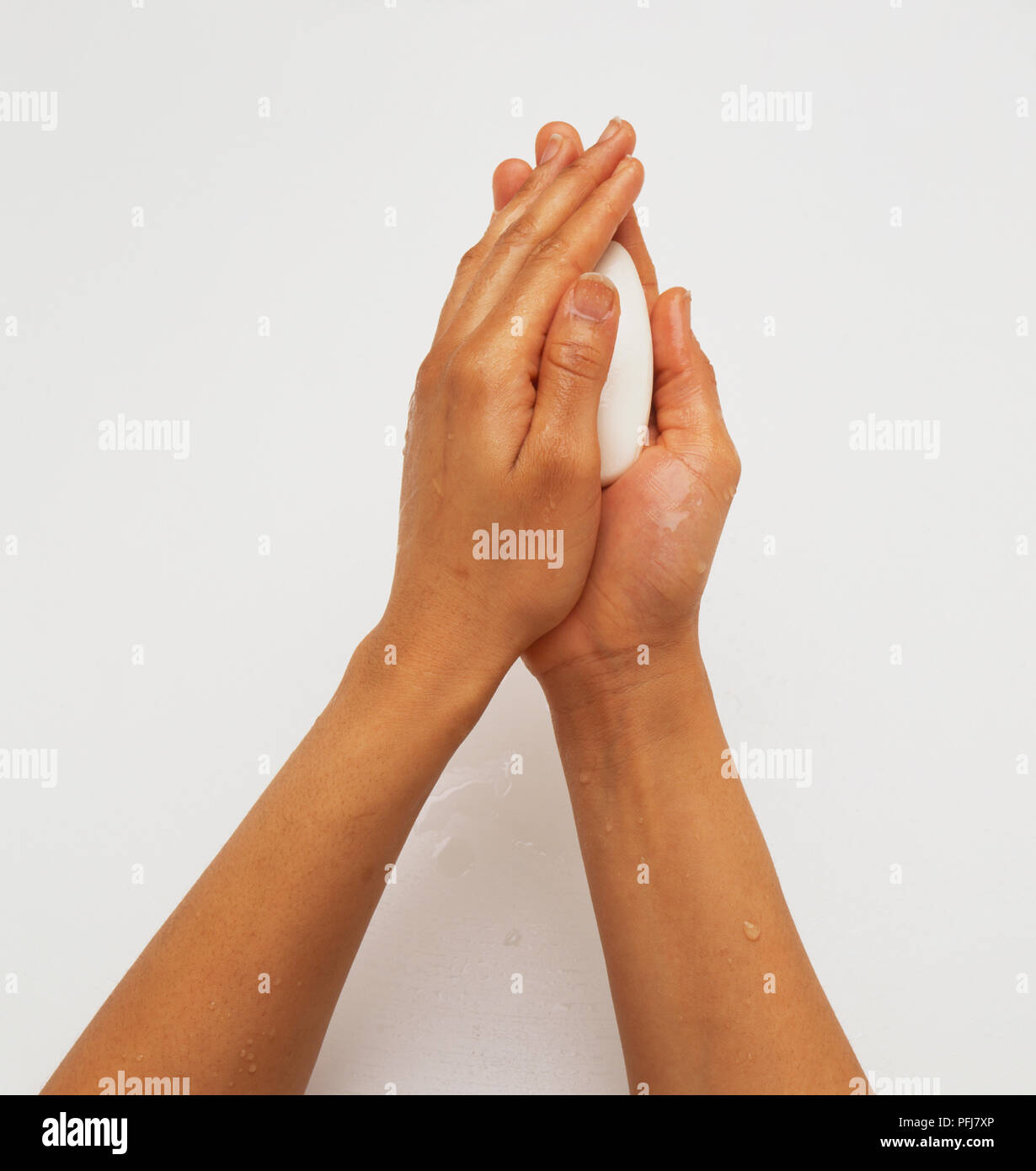 White soap bar clutched between hands Stock Photo - Alamy