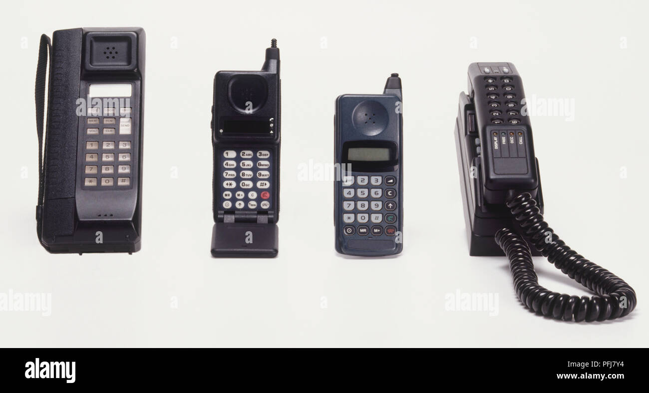 Three cordless phones and one phone with cord and receiver on base, all ...