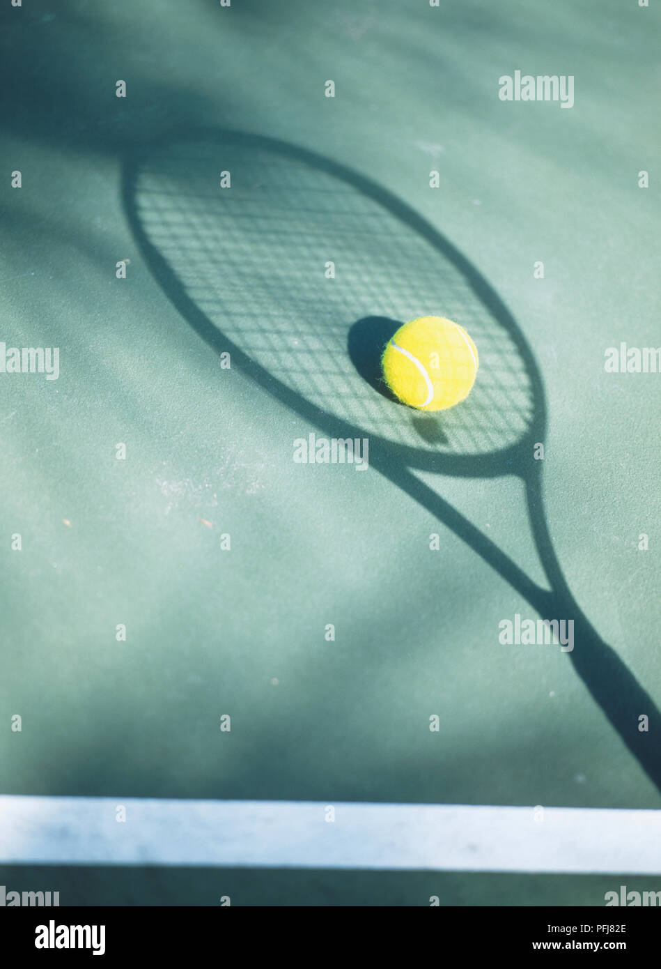 Shadow of a tennis racket, and yellow tennis ball Stock Photo - Alamy