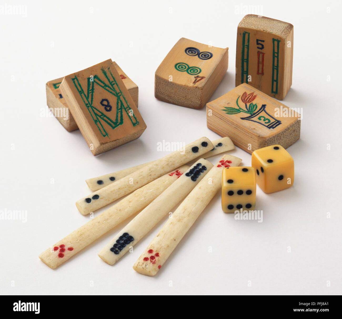 Five Mahjong playing tiles, two dice and five counting sticks Stock ...