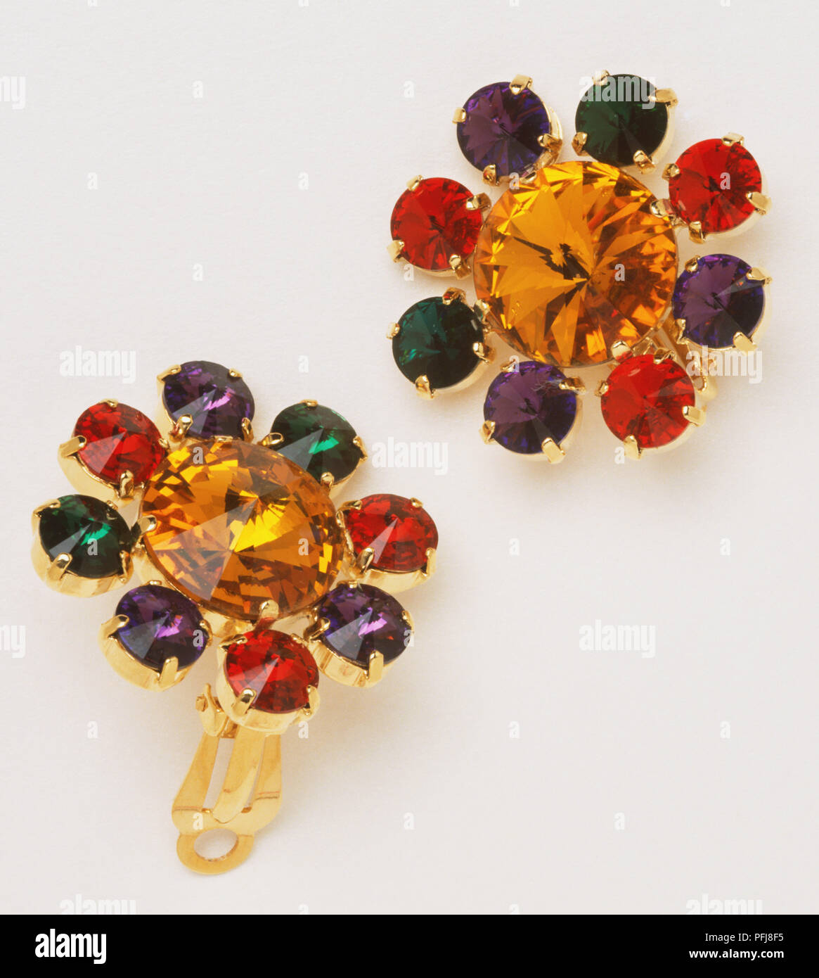 Pair of flower-shaped clip-on earrings, multi-coloured jewels set into ...