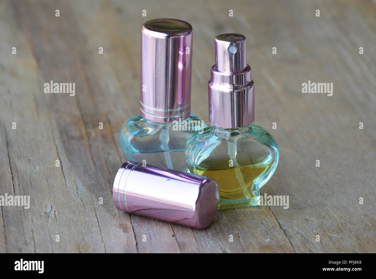 perfume on wooden board Stock Photo - Alamy