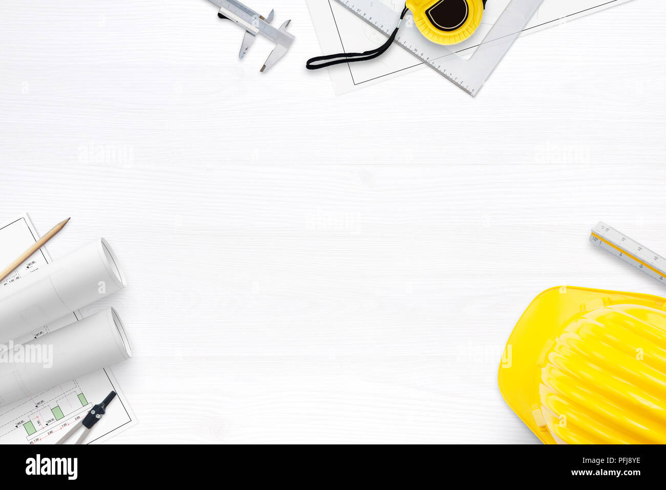 Drawing a project on a work desk. Project papers and tools beside. Free ...