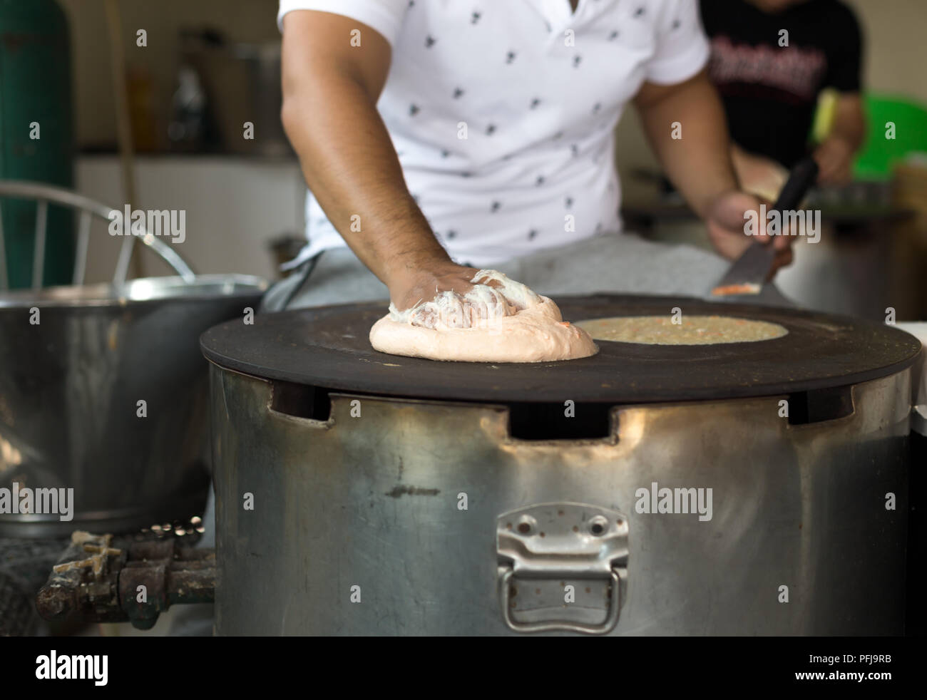 Roti on hot pan street hi-res stock photography and images - Alamy