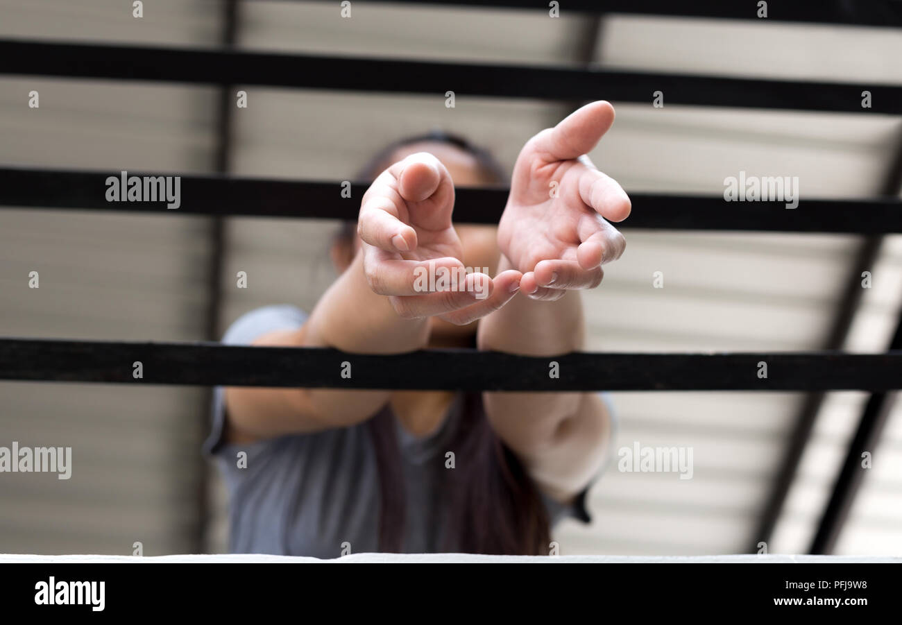 Prison bars hands woman hi-res stock photography and images - Alamy