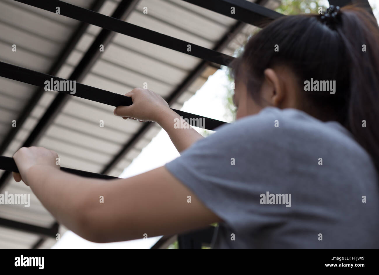 Prison bars hands woman hi-res stock photography and images - Alamy