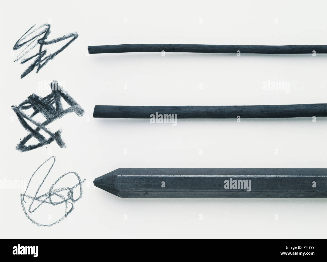 Three charcoal sticks Stock Photo - Alamy