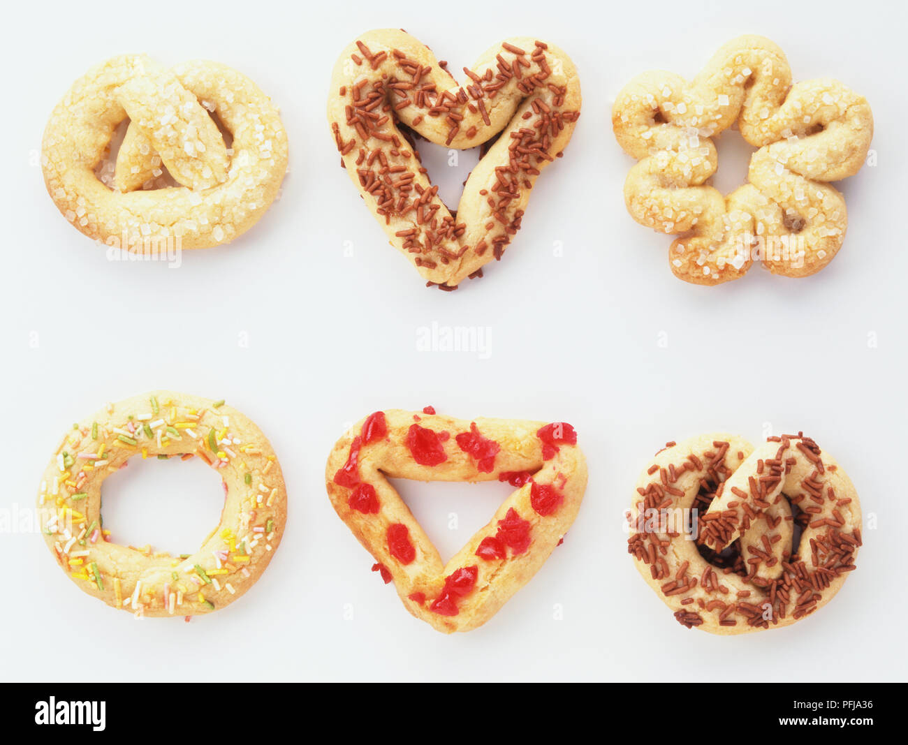 Different shaped biscuits decorated with chocolate and sugar sprinkles ...