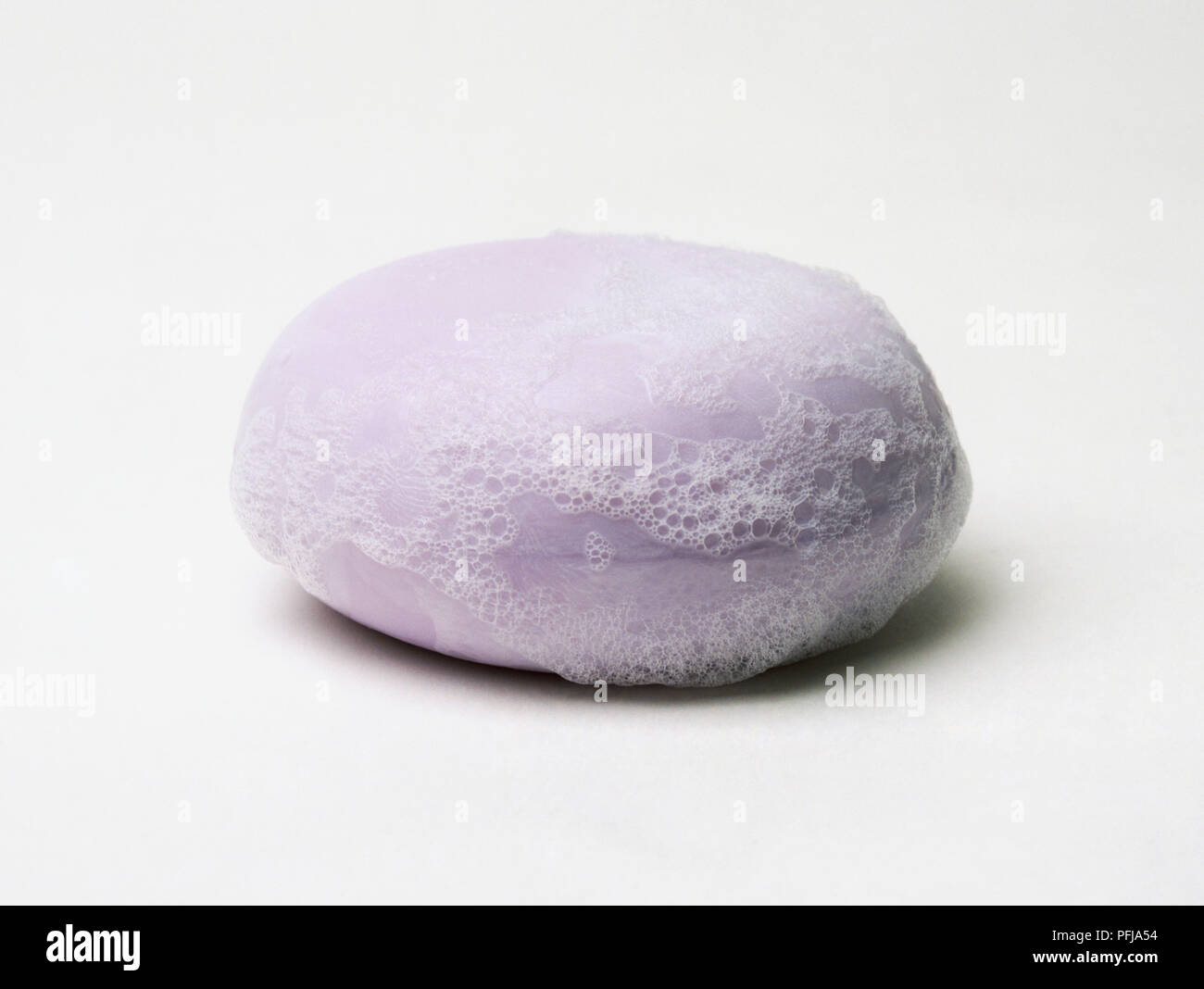 Lavender soap covered in suds Stock Photo - Alamy