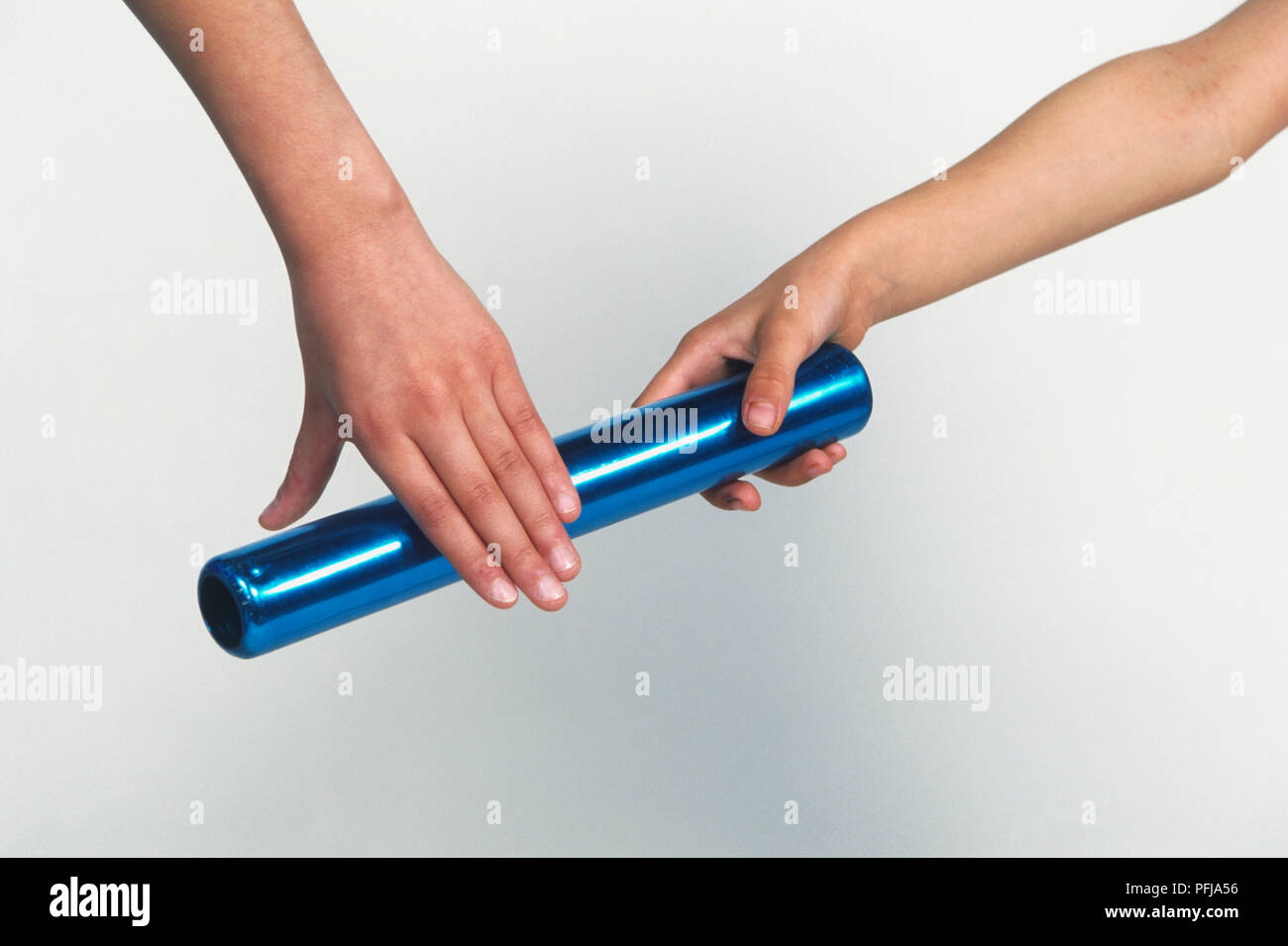 Passing a blue baton Stock Photo - Alamy